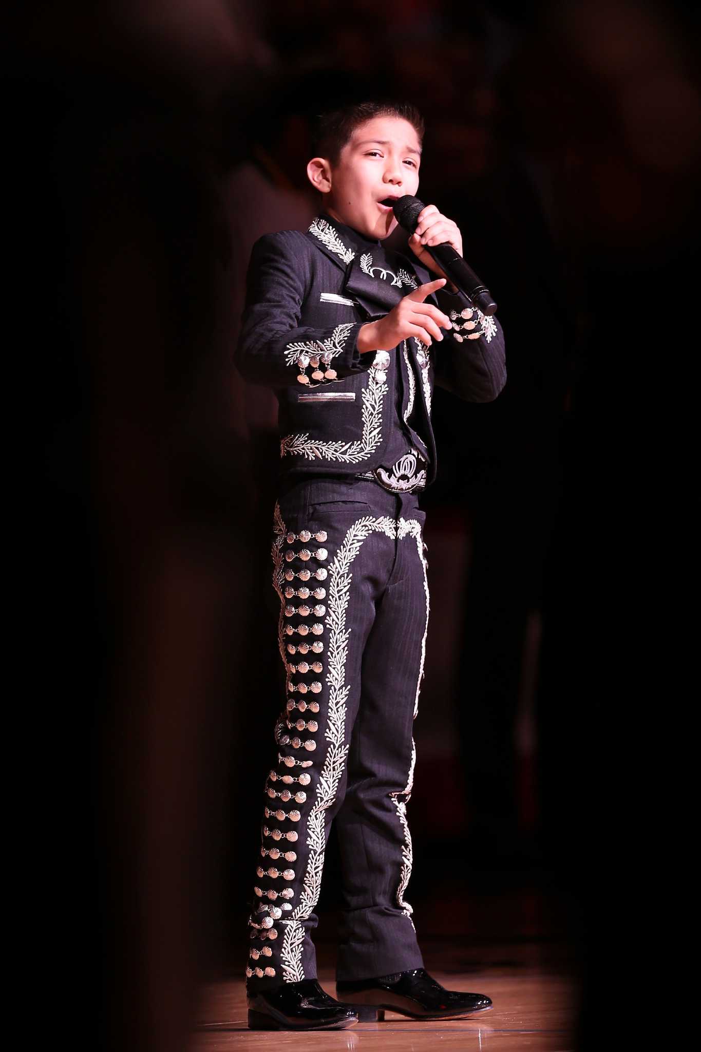 Young mariachi sings anthem again