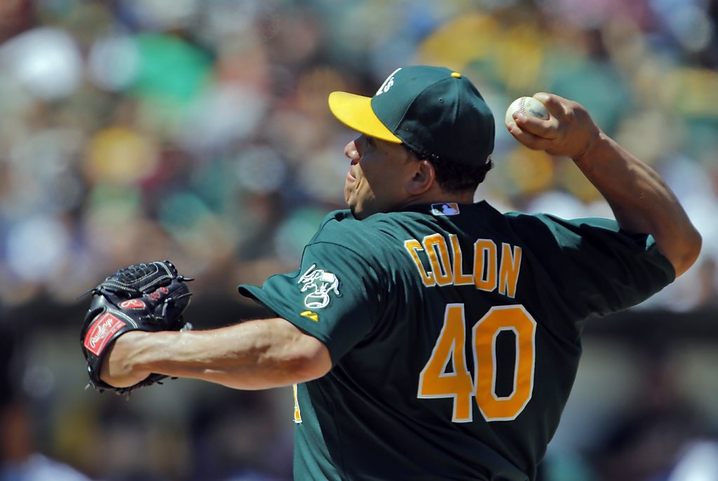 A's bats come alive to back Colon, 10-2