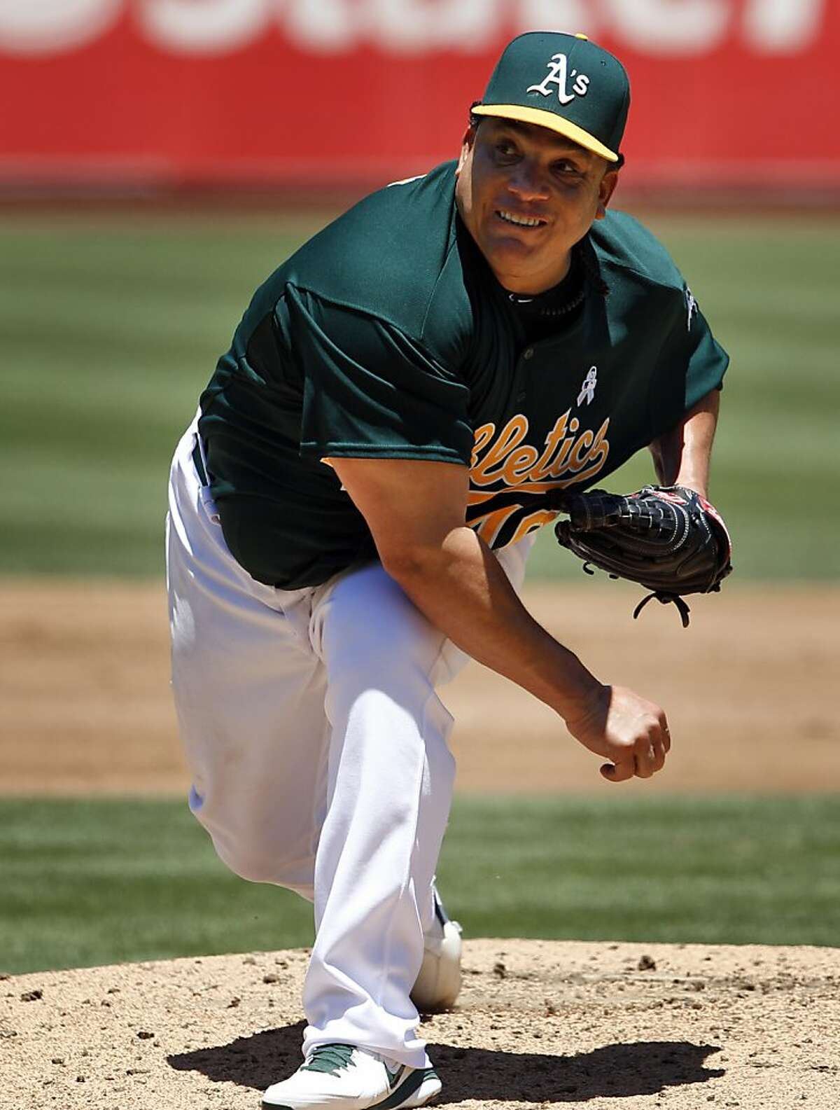 A's bats come alive to back Colon, 10-2