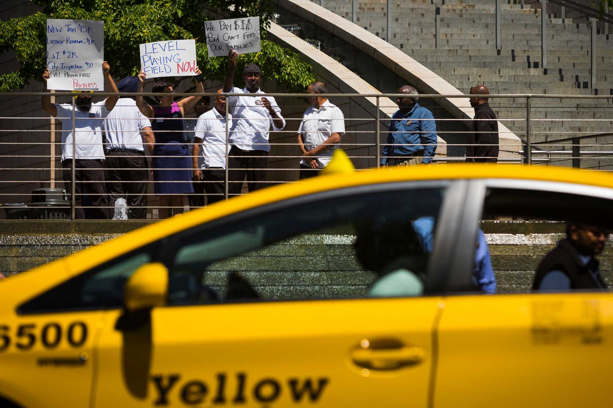 Taxi drivers rally at Seattle City Hall