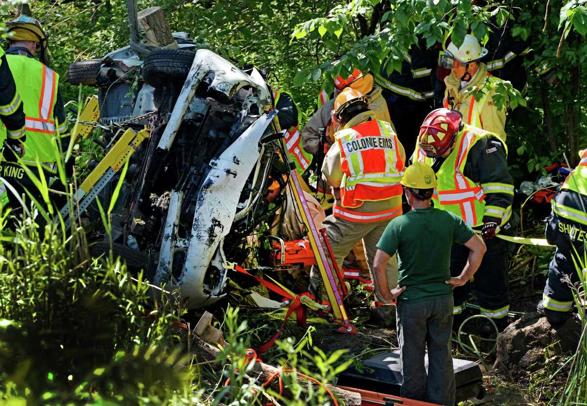 Tree topples on car after crash