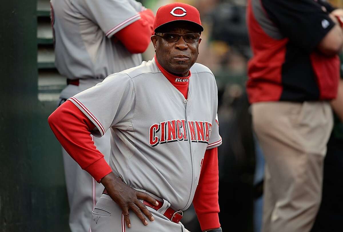 A's beat Reds 7-3, in virtual tie for 1st