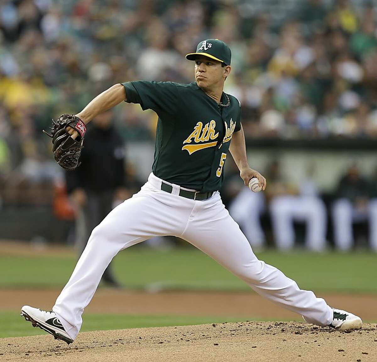 A's beat Reds 7-3, in virtual tie for 1st