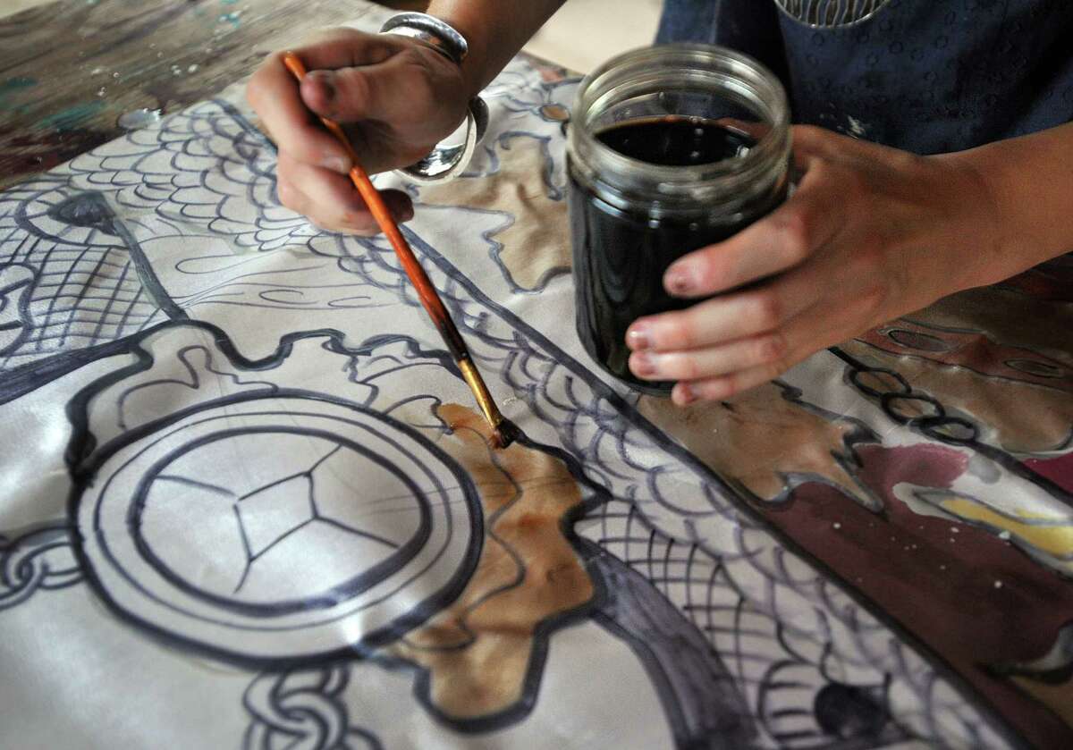 Artist uses dresses as her canvas