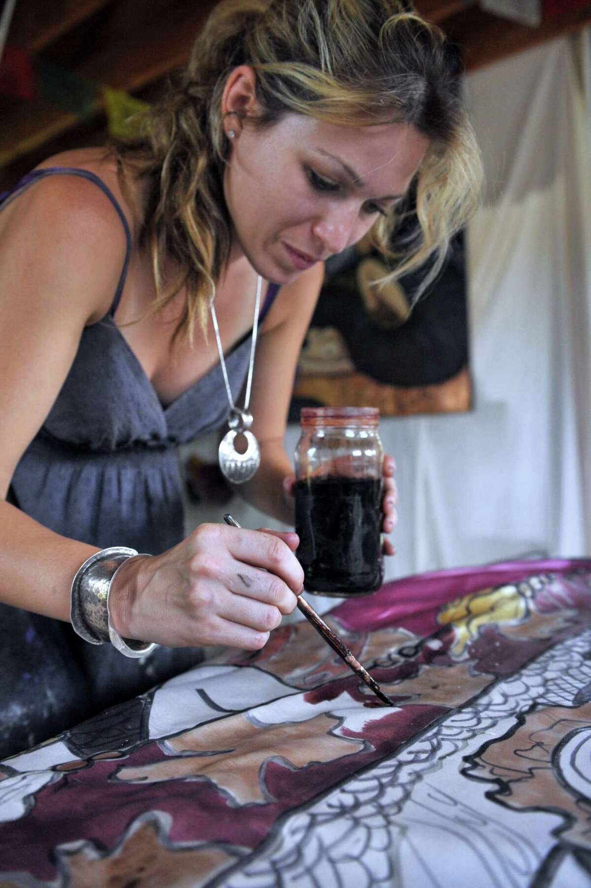 Artist uses dresses as her canvas
