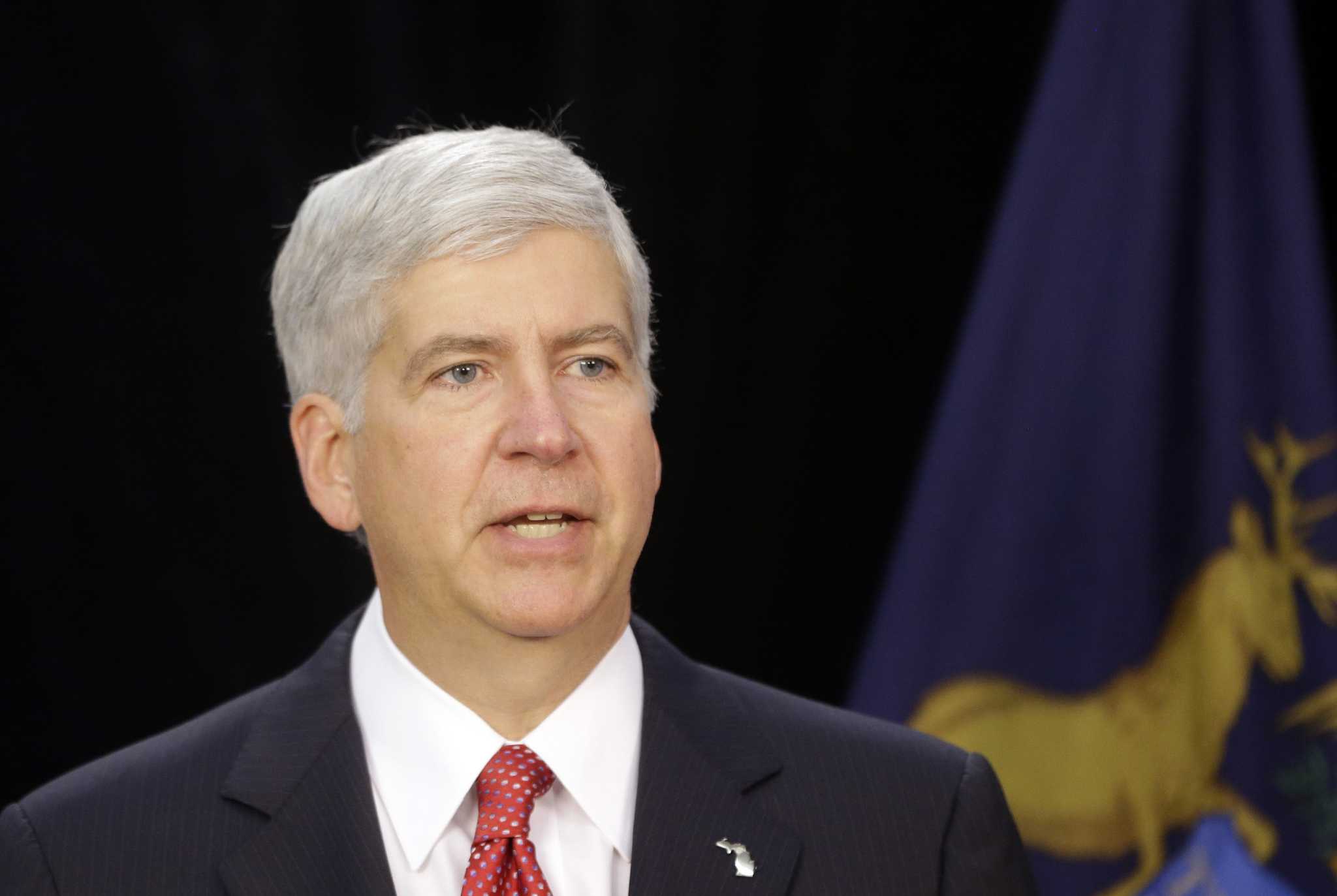 Mich. governor front, center in Detroit bankruptcy