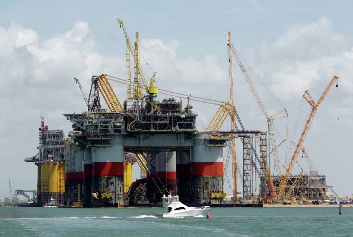 Oil platforms rise high to reach for the deep