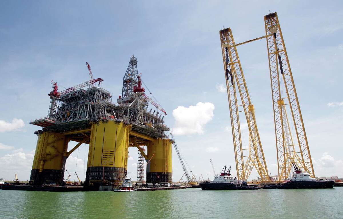Oil platforms rise high to reach for the deep