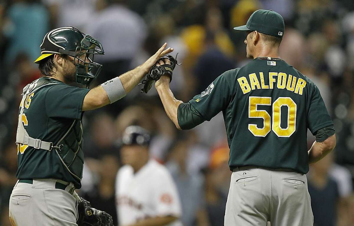 A's nearly give it away, top Astros, 4-3