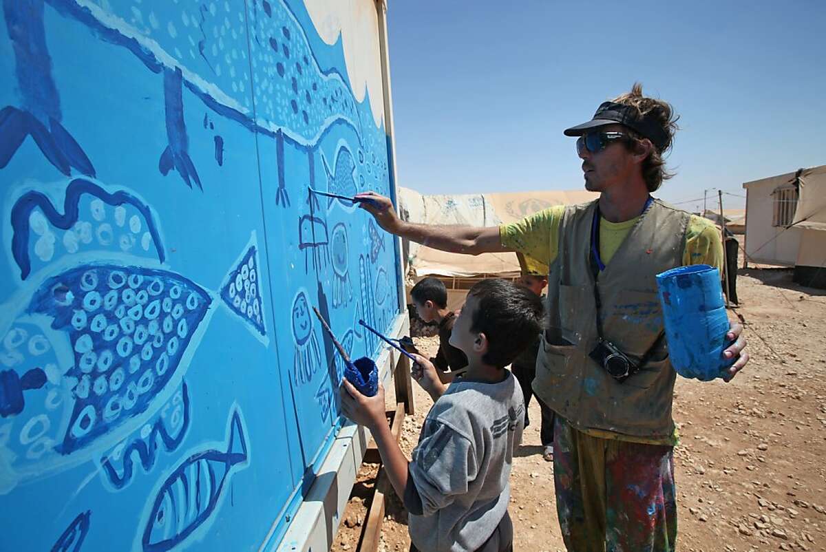 Syrian refugee kids using art to brighten camp