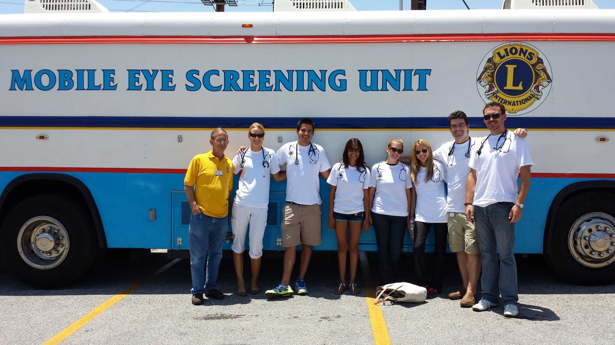 Students perform eye screenings