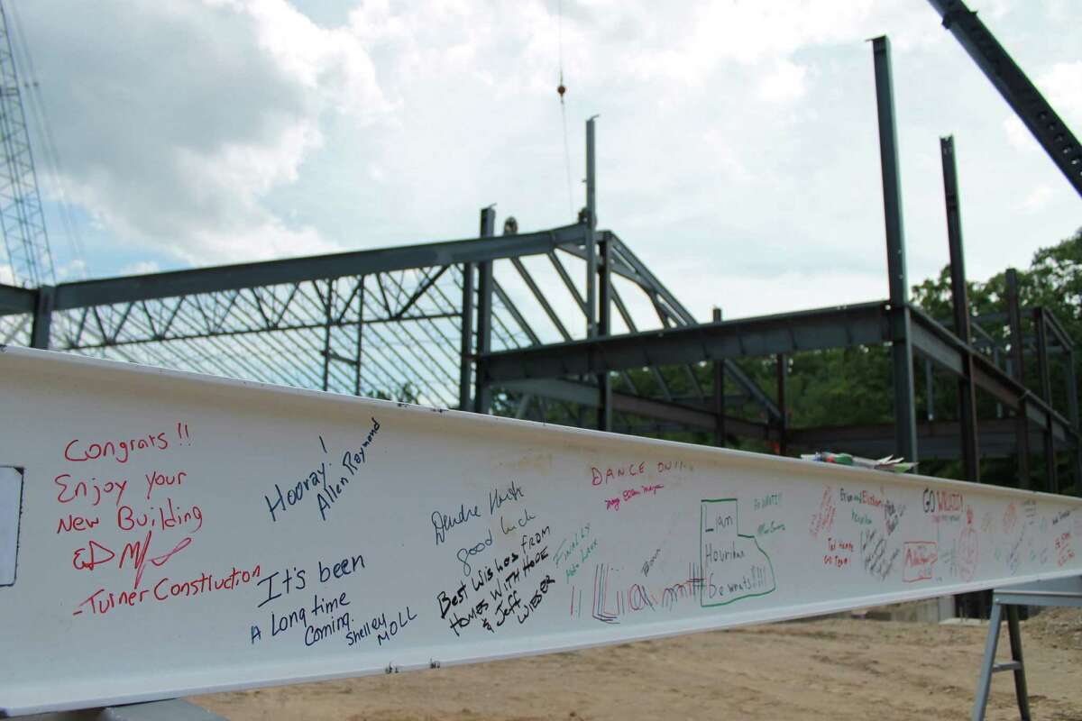 Top notched: Ceremonial beam a high point for Westport Y construction