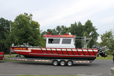 Out on a test run, fire safety boat helps yacht