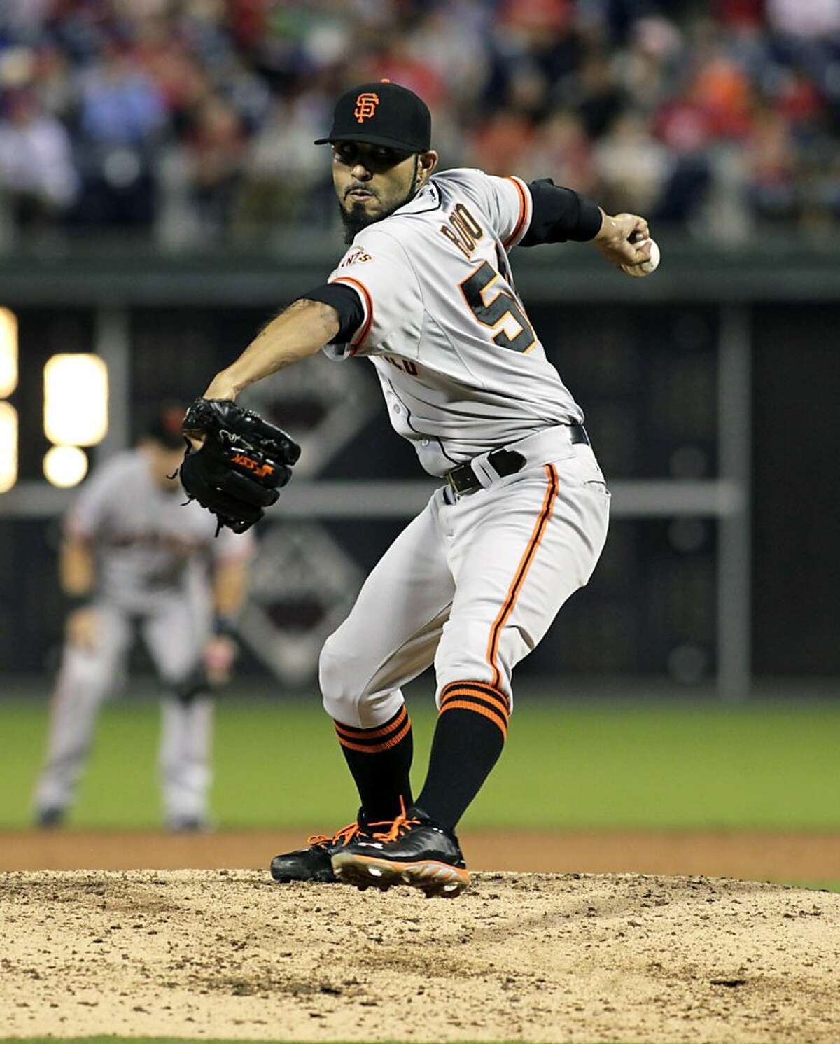 Romo survives crazy 9th to save Cain's win