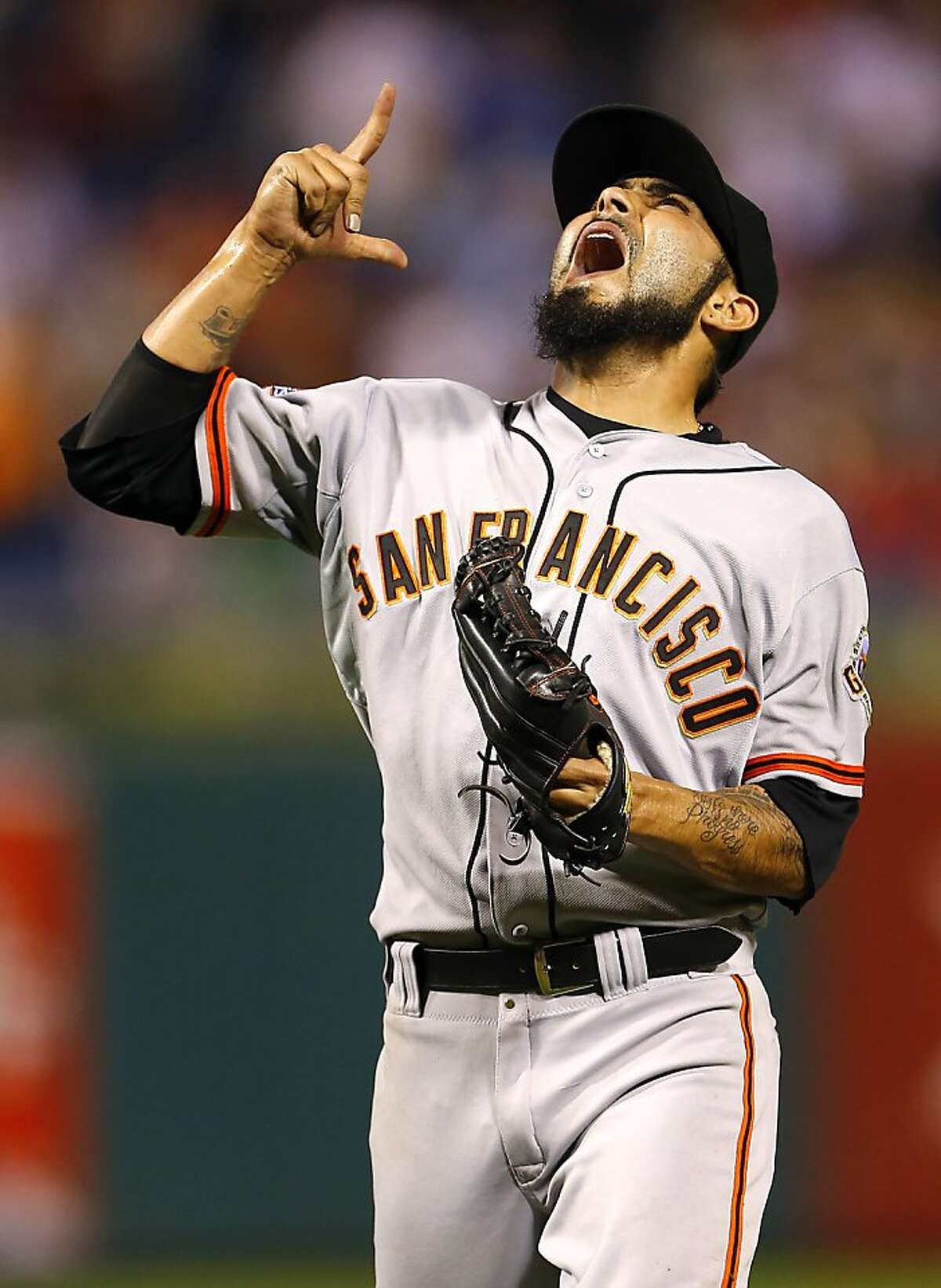 Romo survives crazy 9th to save Cain's win