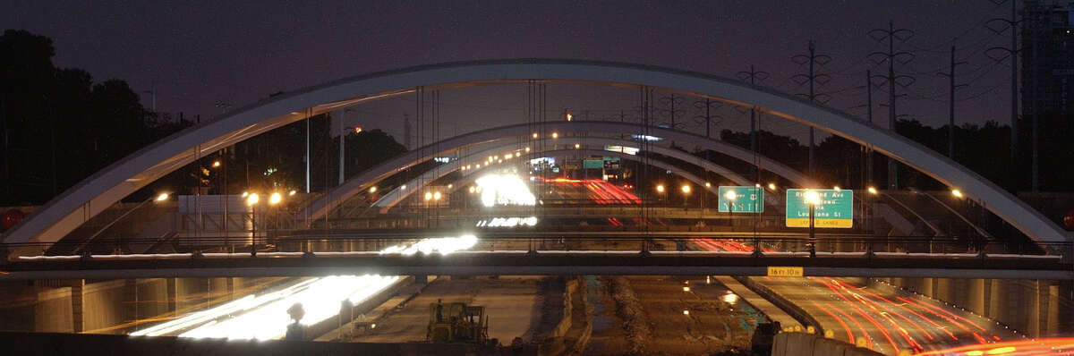 Lights over arch bridges over Southwest Freeway may sparkle again