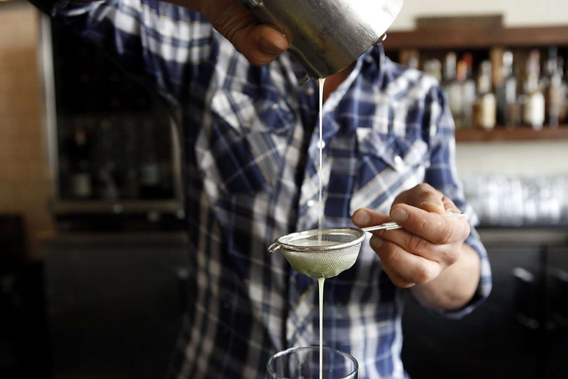 Cocktails take a seat at ever-finer tables