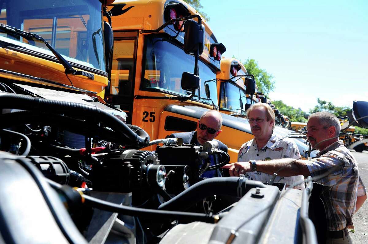 Shelton swaps yellow school buses for "green"