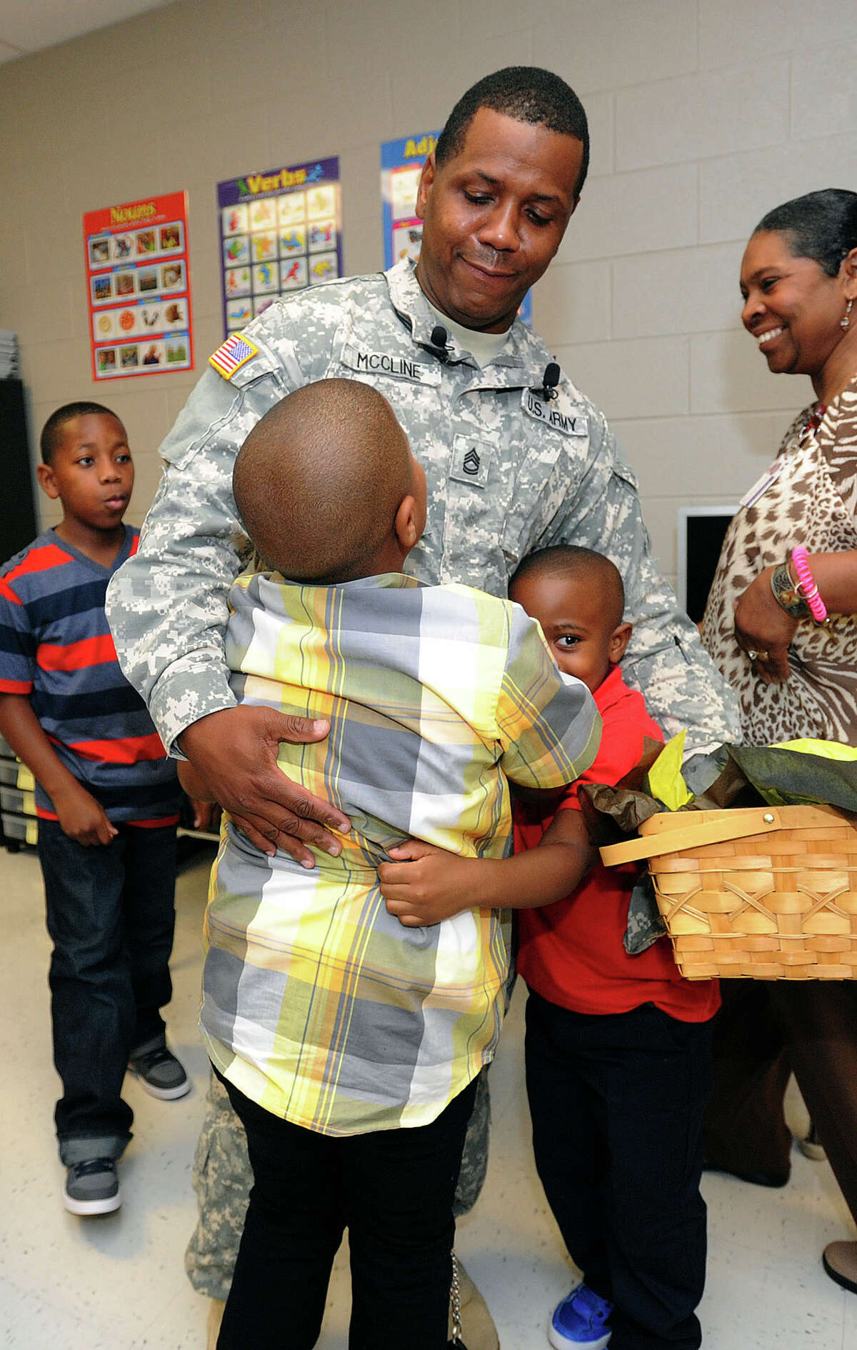 After year-long absence, dad surprises three sons with classroom visit