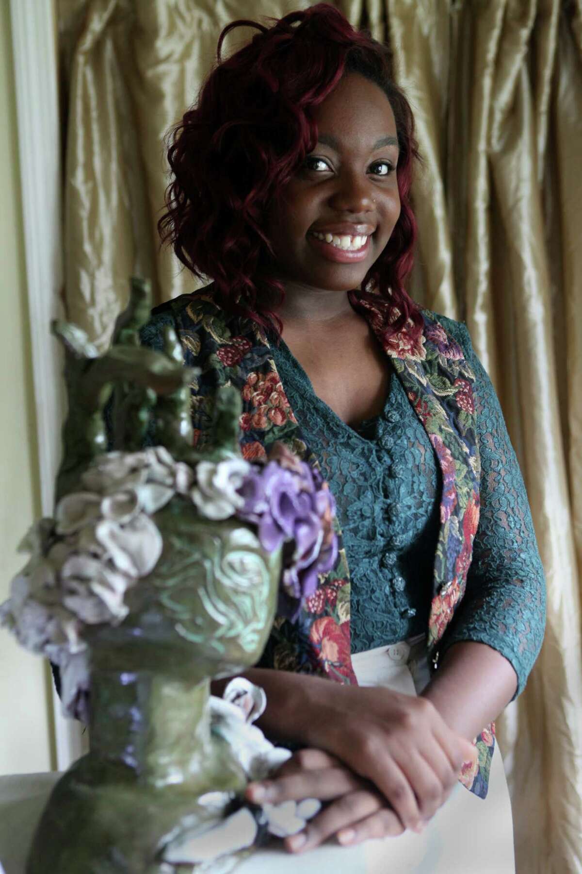 Teen succeeds in painting her way to college