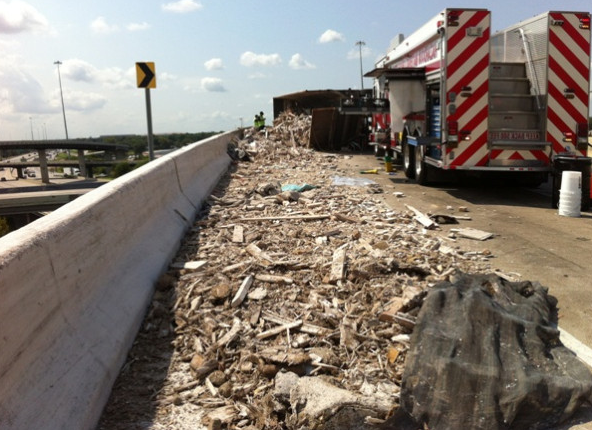 Big rig flips on 610 North Loop ramp heading to U.S. 59