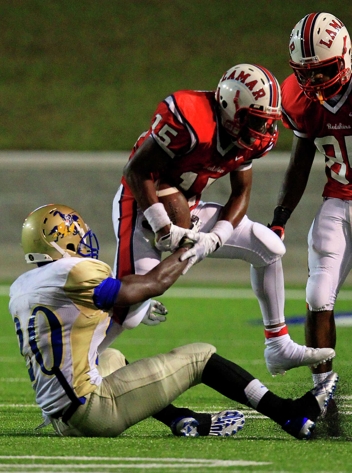 Lamar turns Elkins' mistakes into 38-6 victory