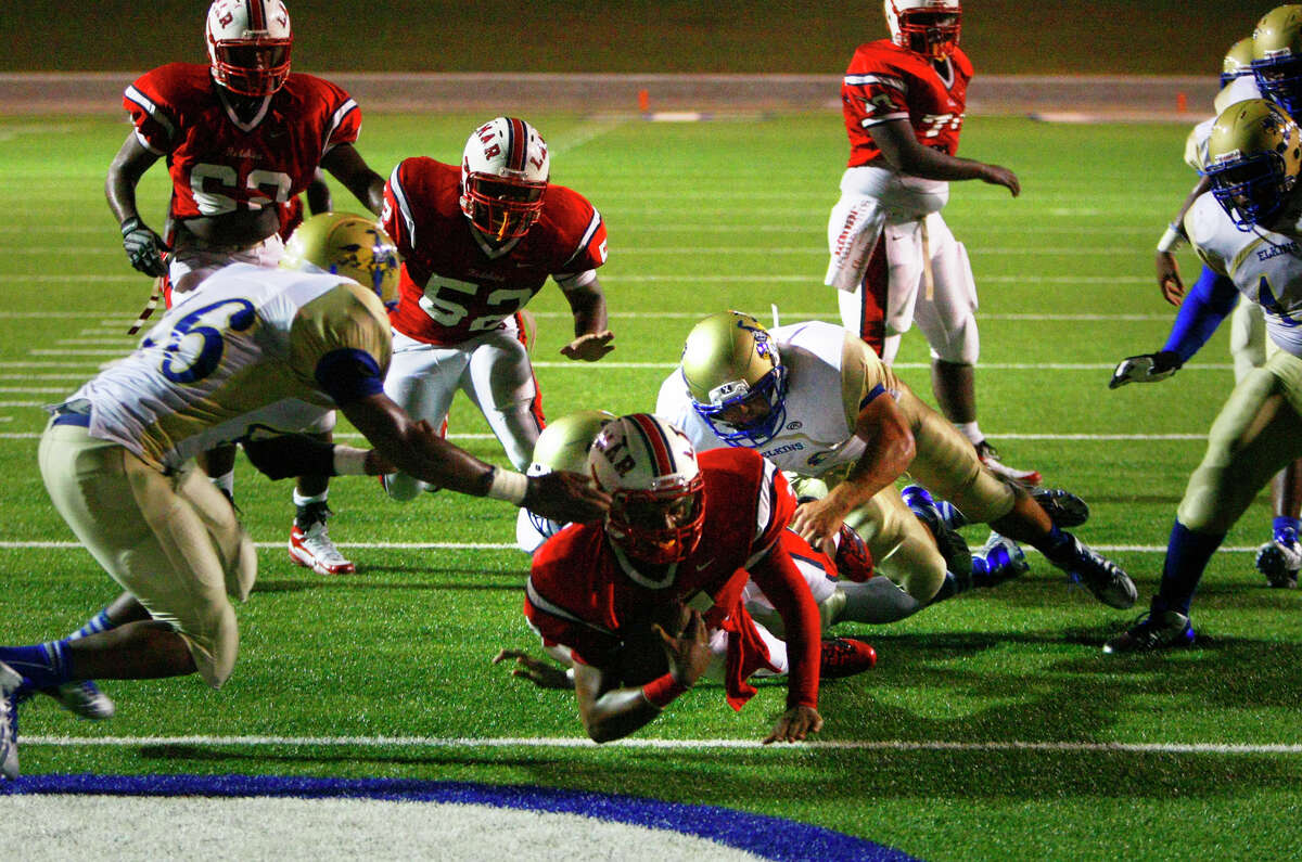 Lamar turns Elkins' mistakes into 38-6 victory