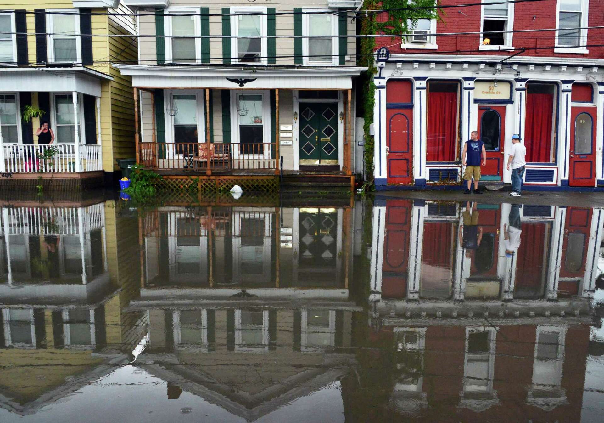 Floods swamp roads after heavy rainfall