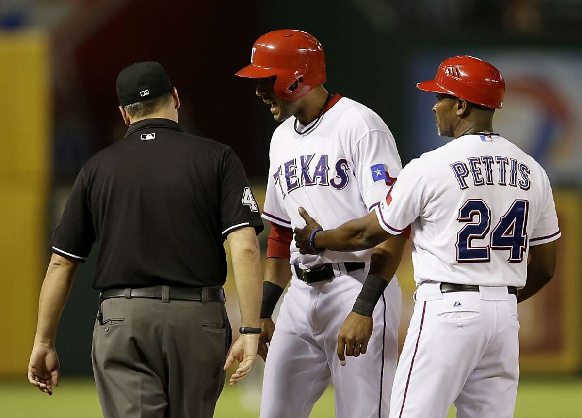 A's hold off Rangers in 9-8 marathon