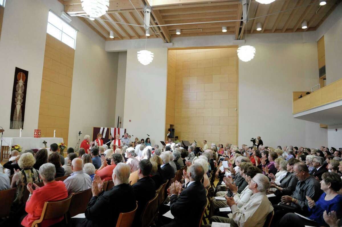 Group installs female priest