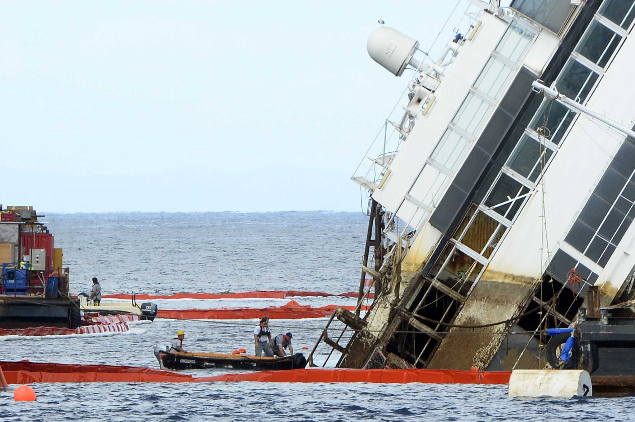 After day of delays, cruise ship upright