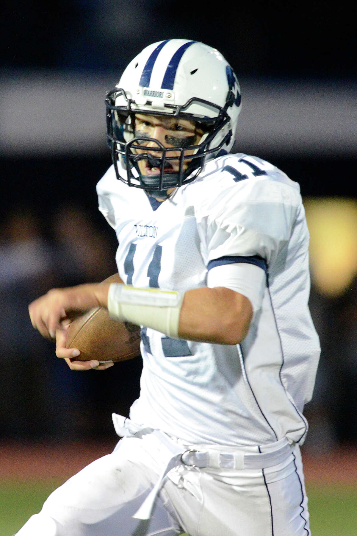 Staples football holds off Wilton