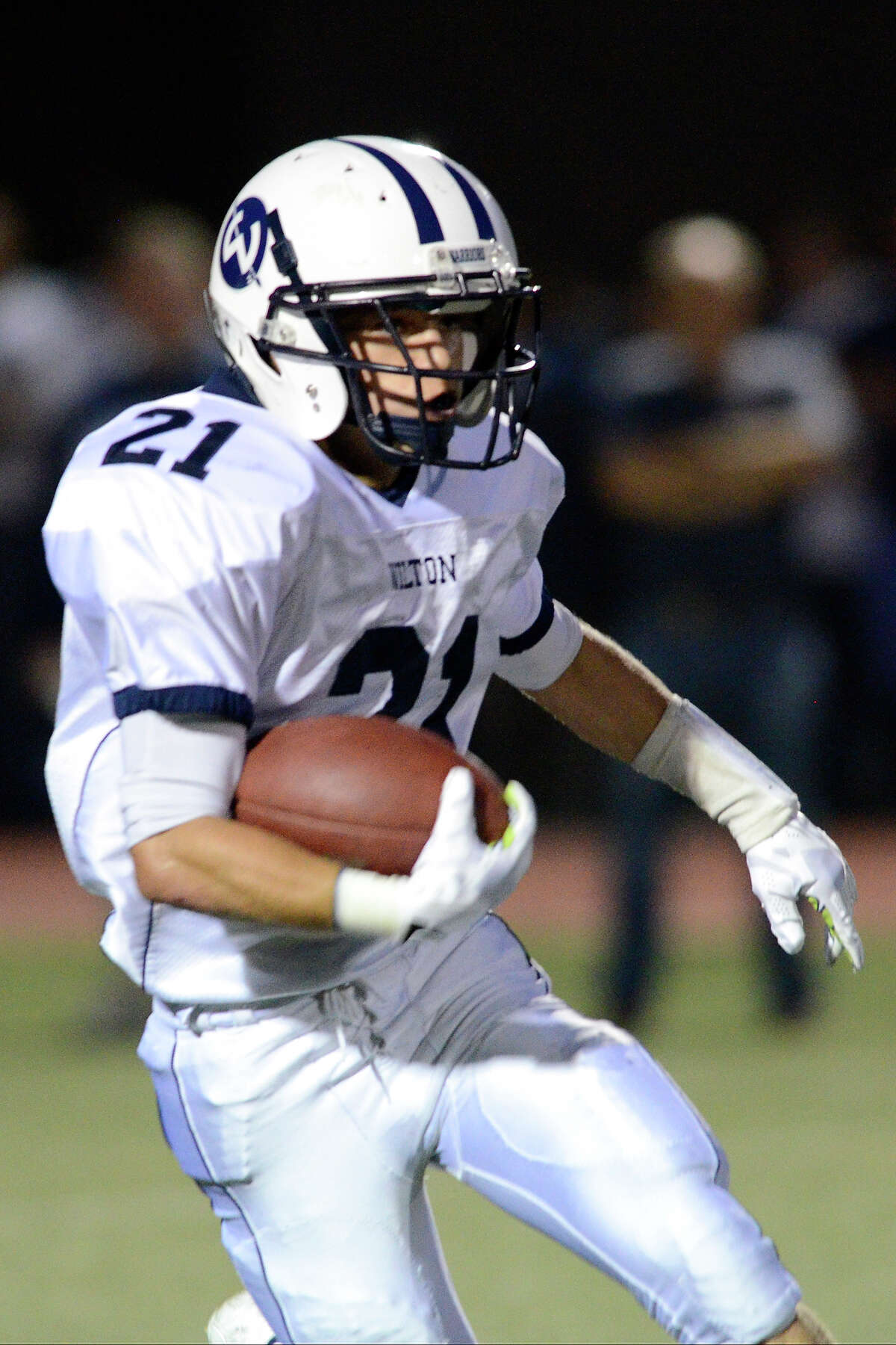 Staples football holds off Wilton