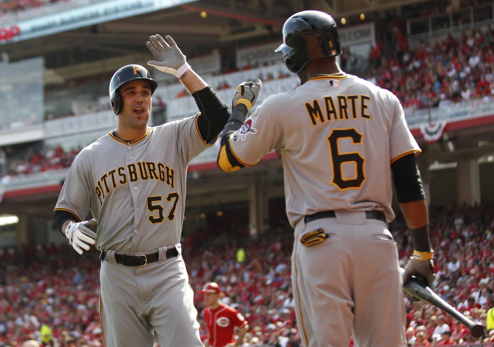 Pirates beat Reds, will host playoff