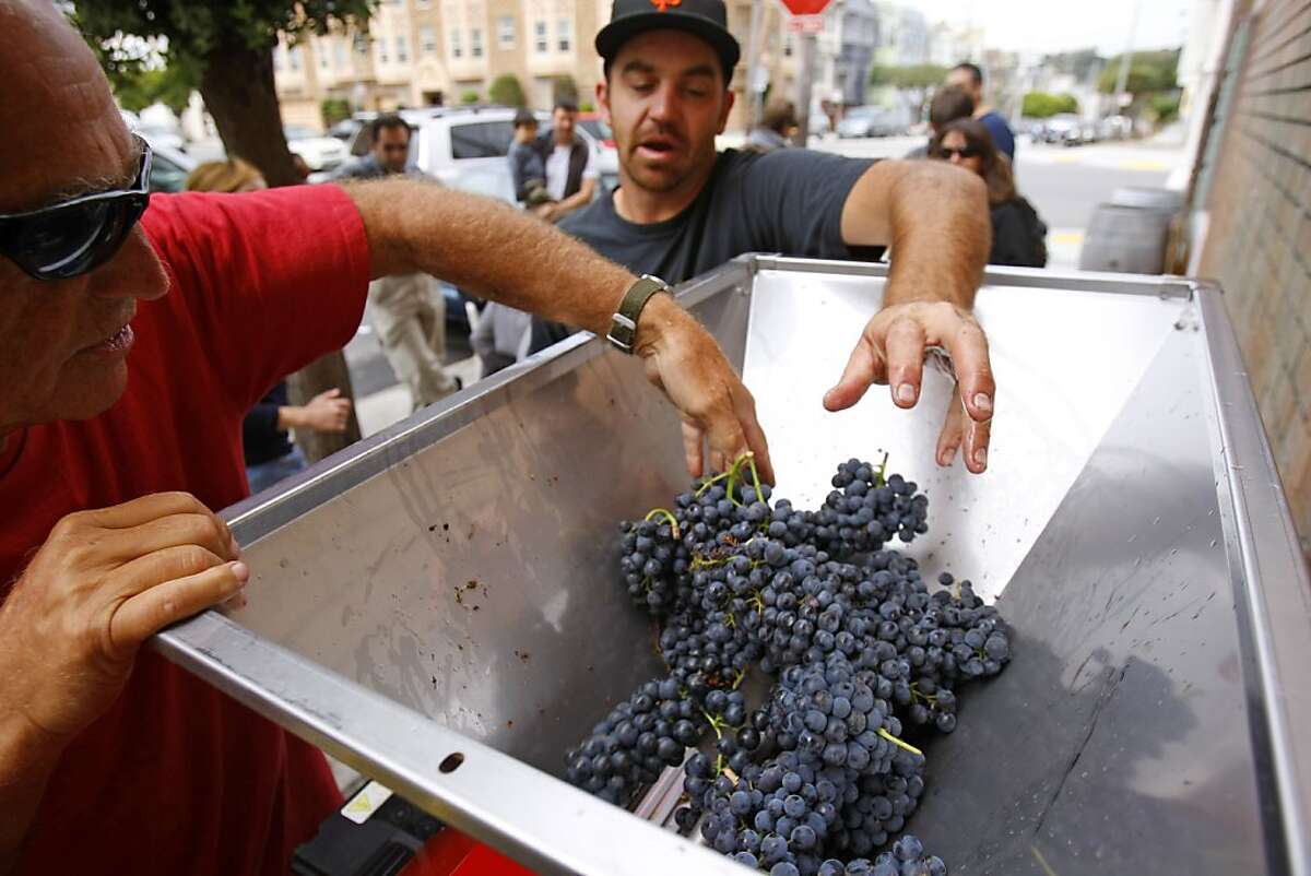 Winemakers stomp their own at street-side seminar