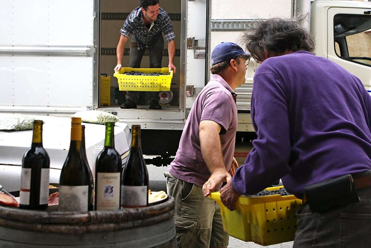 Winemakers stomp their own at street-side seminar