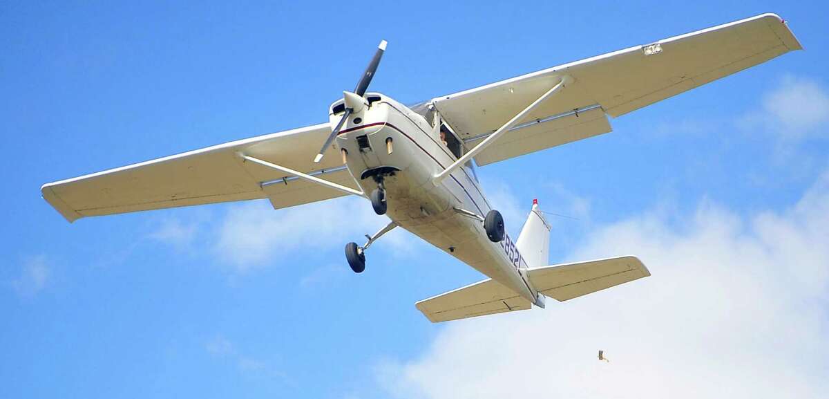 Pilots test their aim with flour sacks at airport day