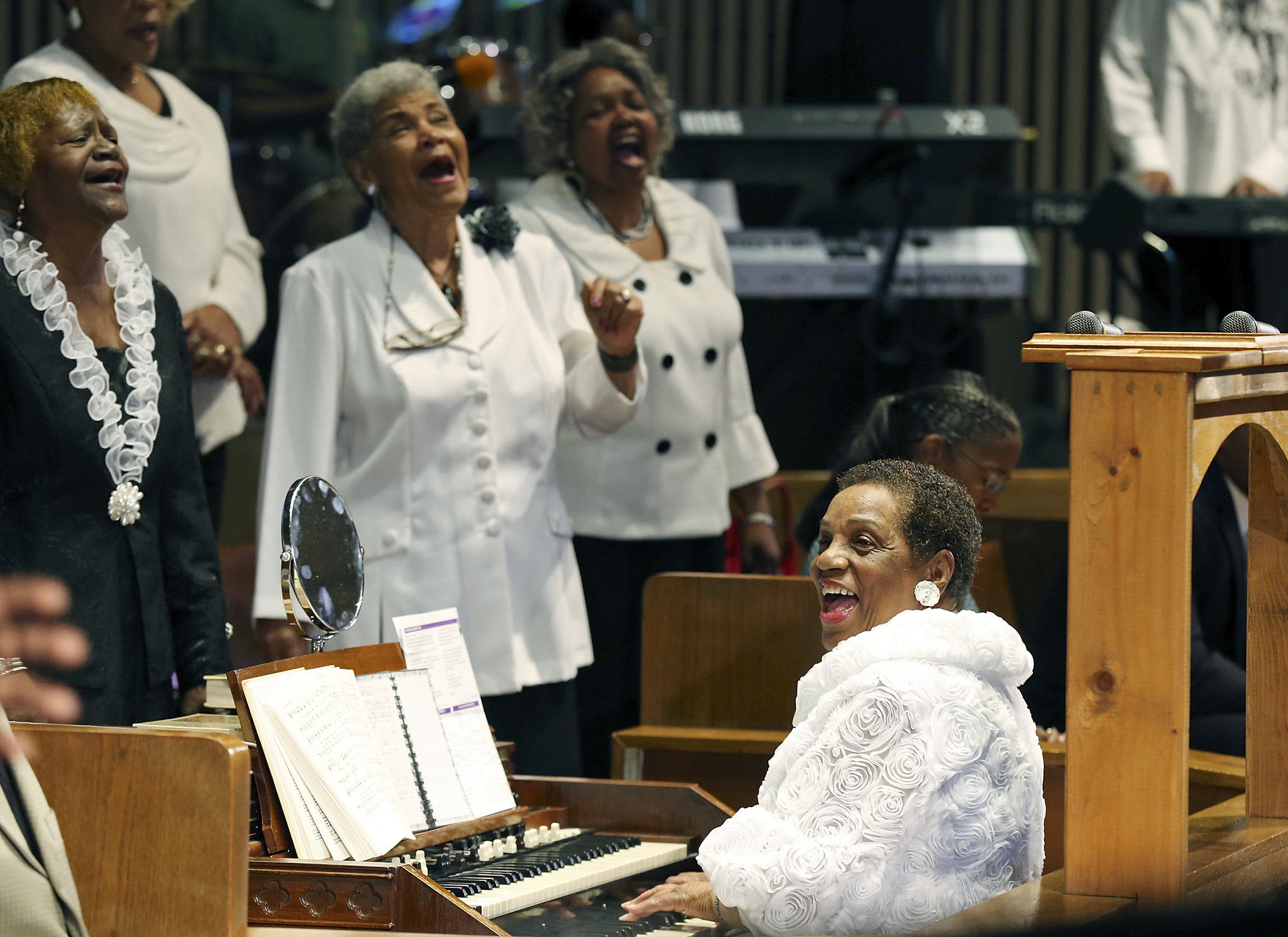 As choir director, this woman's accomplishments are noteworthy