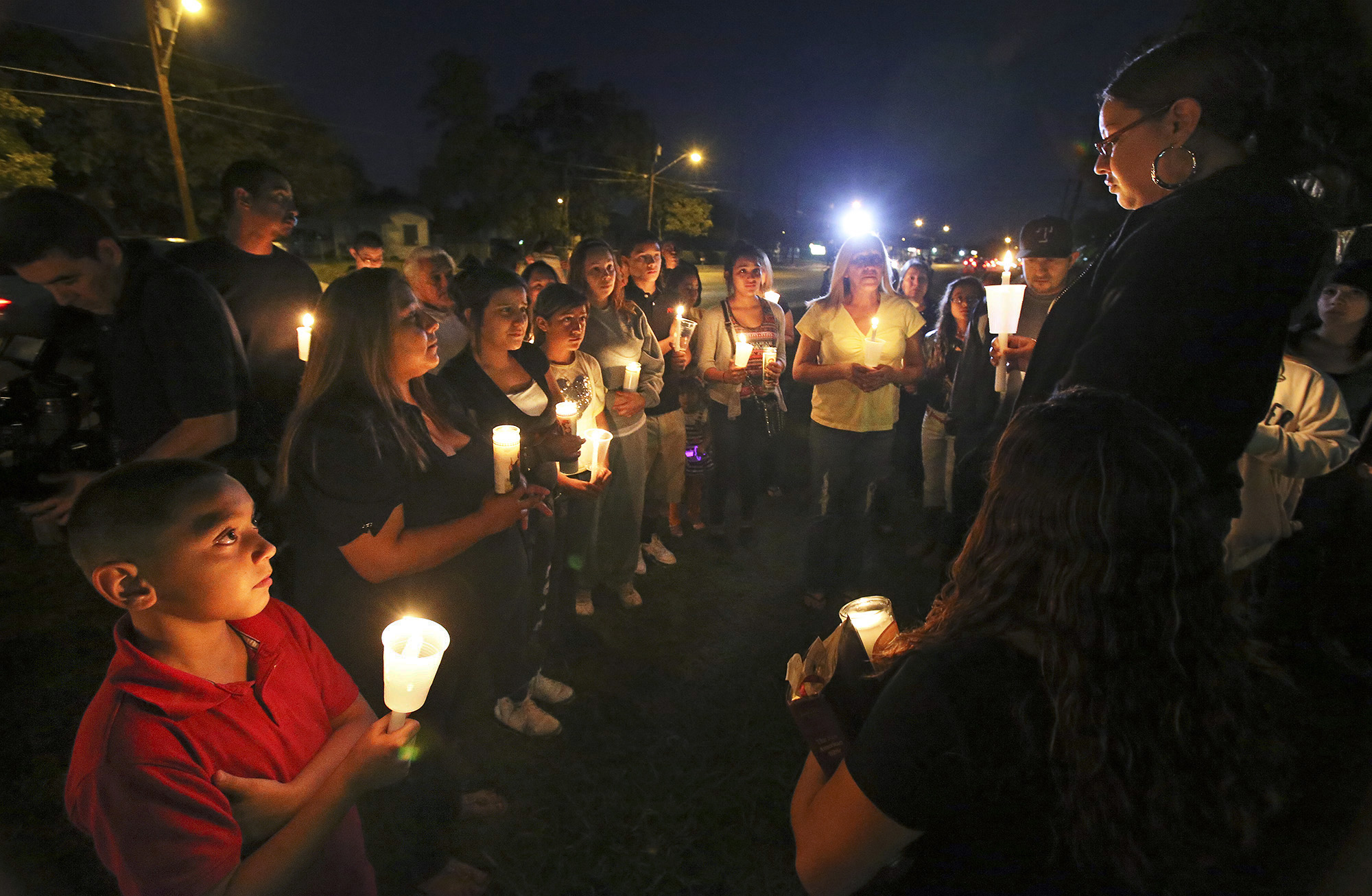 Vigil is held for mom who saved her kids