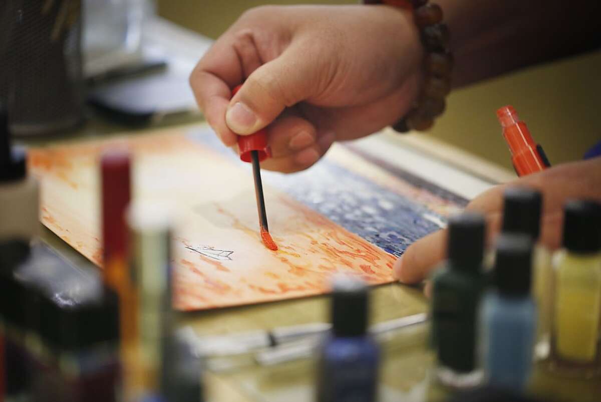 Makeup artist creates scenes on the cosmetics floor