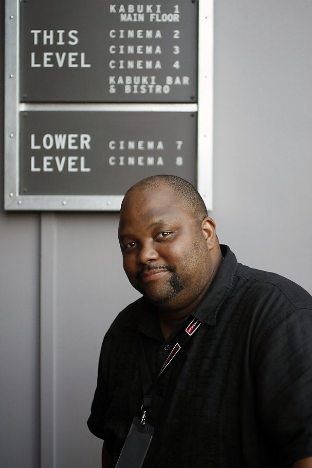 Movie theater host checks IDs, talks films