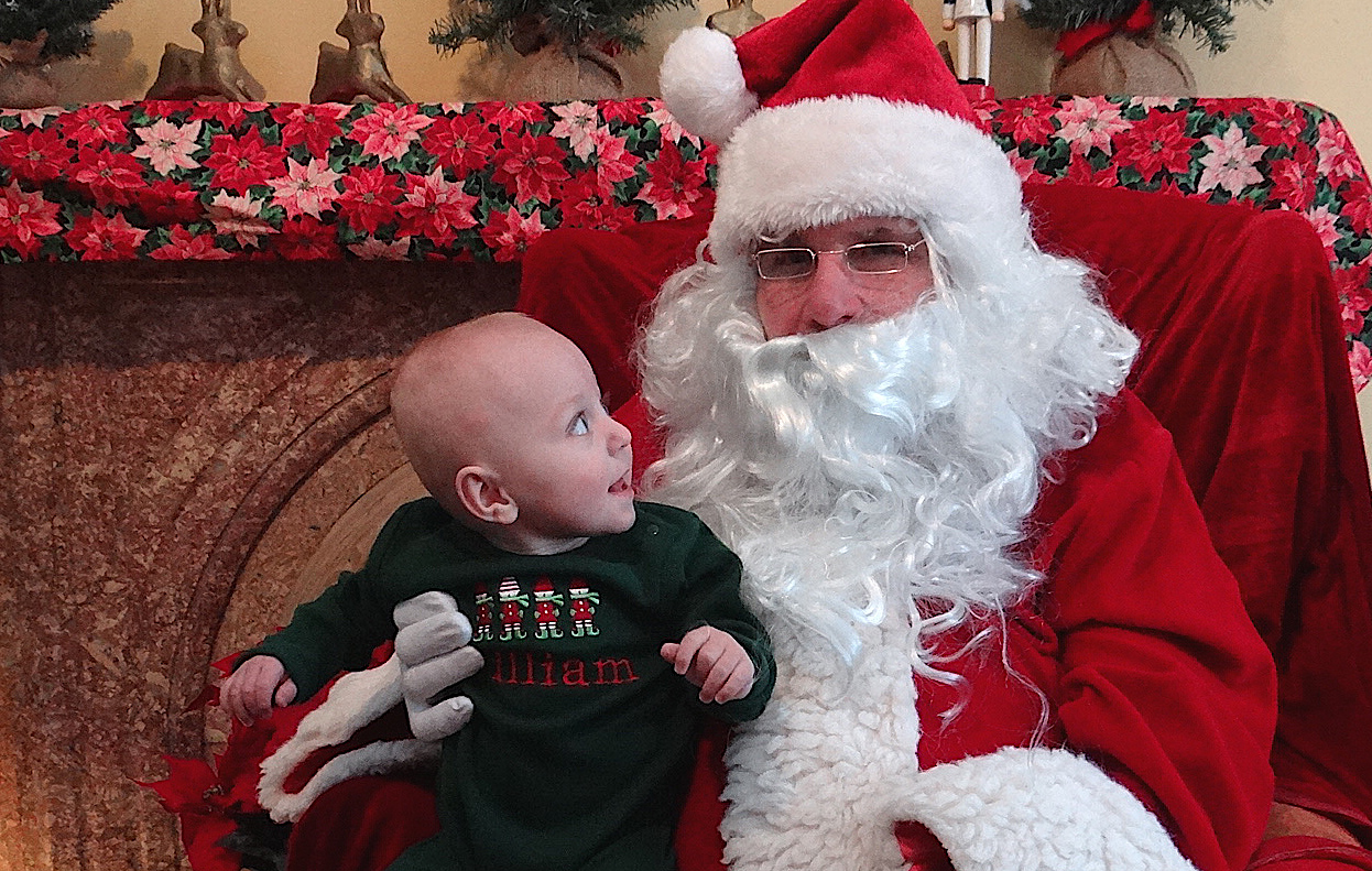 Santa celebrates the season with a snowy visit to his Fairfield house