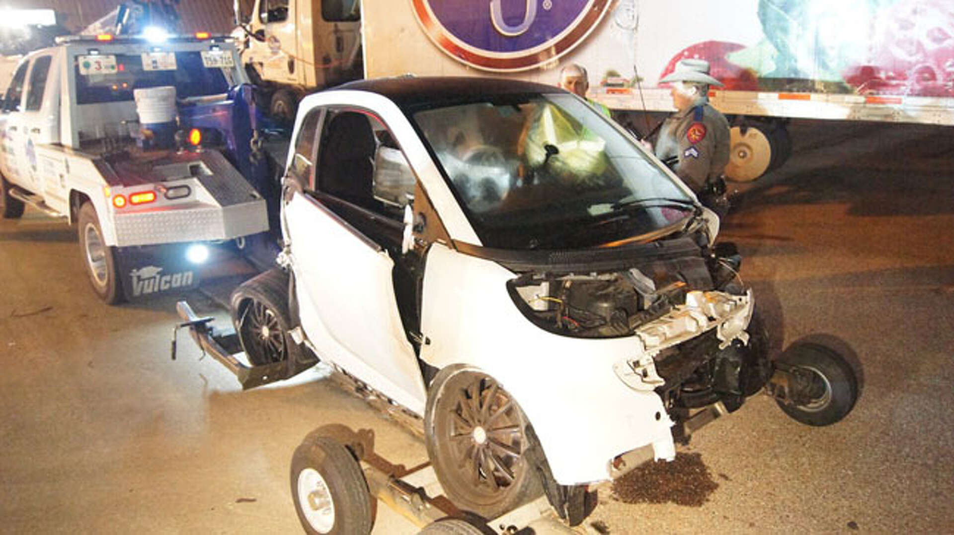 Smart Car crushed by 18-wheeler