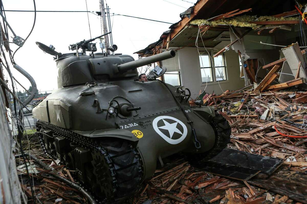 Sherman tank smashes building during demolition