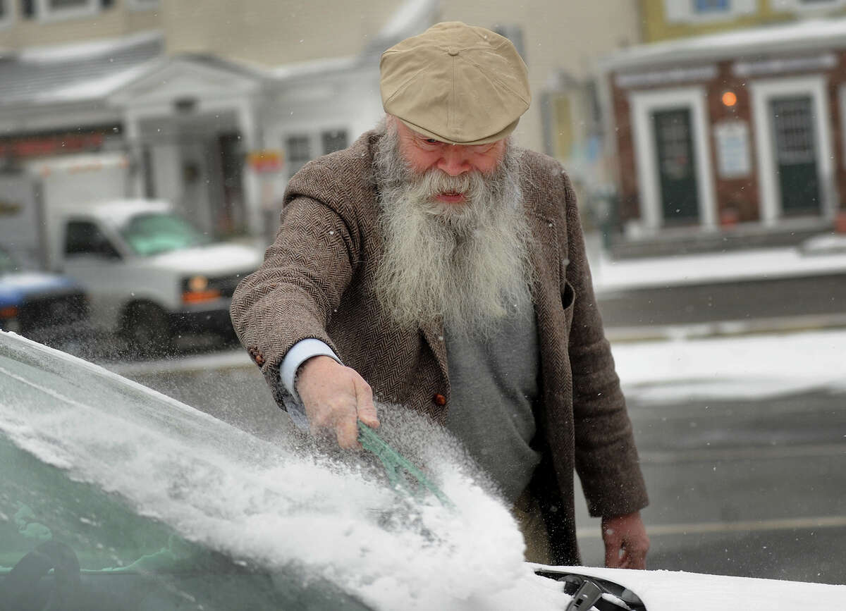 Snow, plunging temperatures challenge city