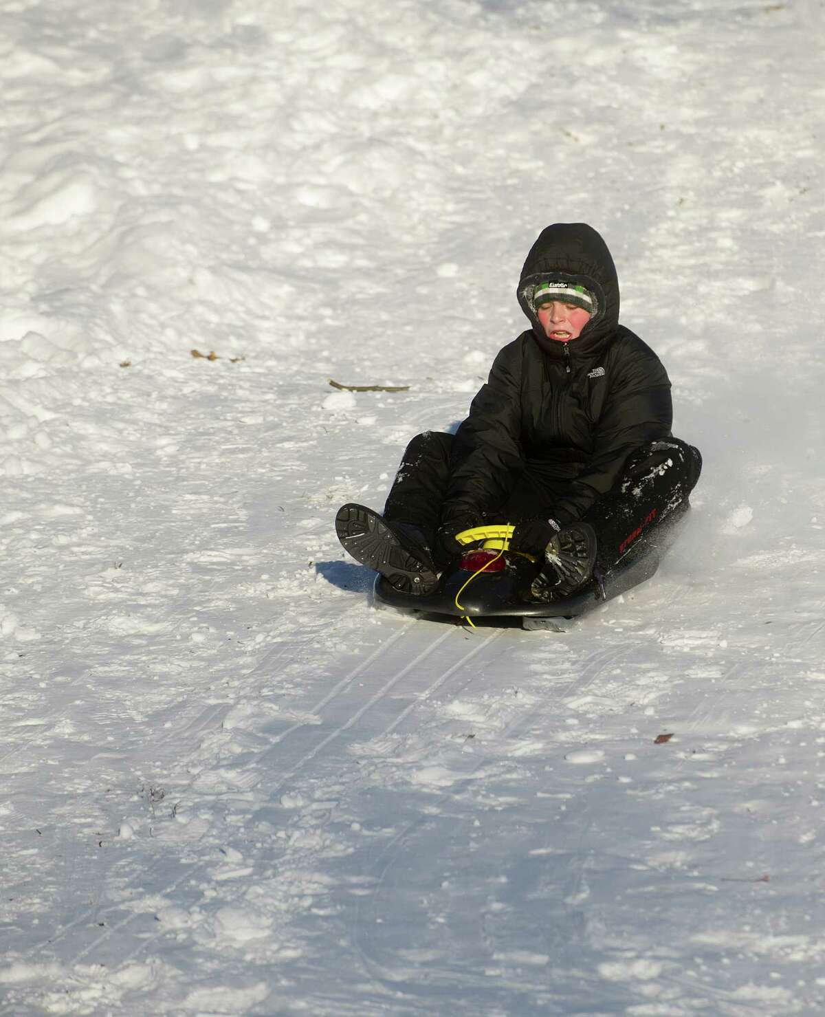 Snow moves out, leaves bitter cold and wind behind