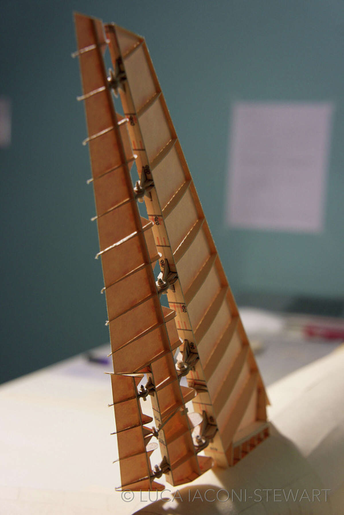 Man building Boeing 777 out of manila folders