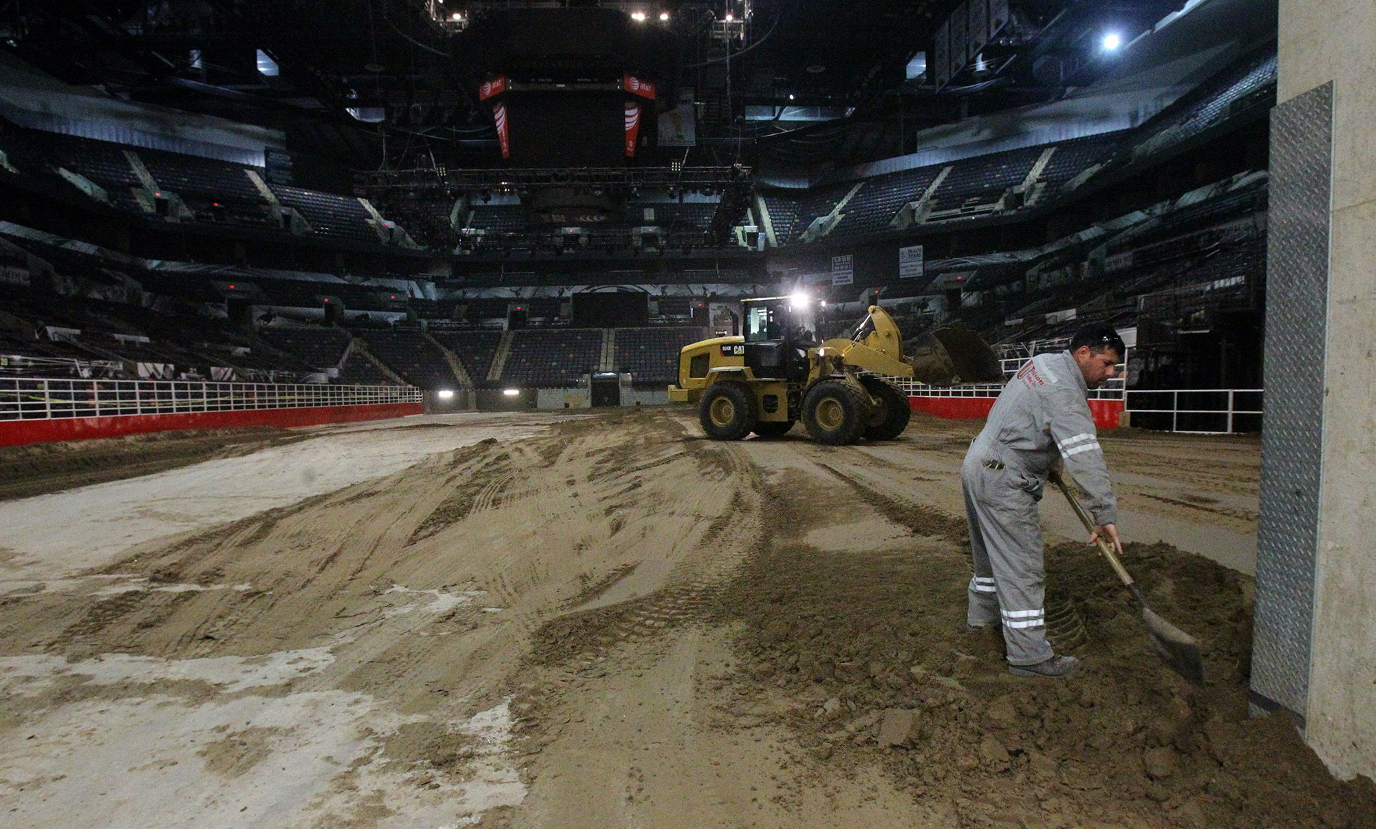 Before they saddle up, dirt goes down at arena