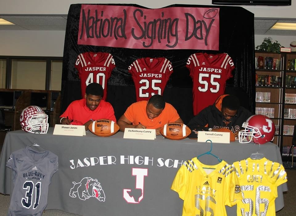 Jasper Football Athletes signing letters of Intent