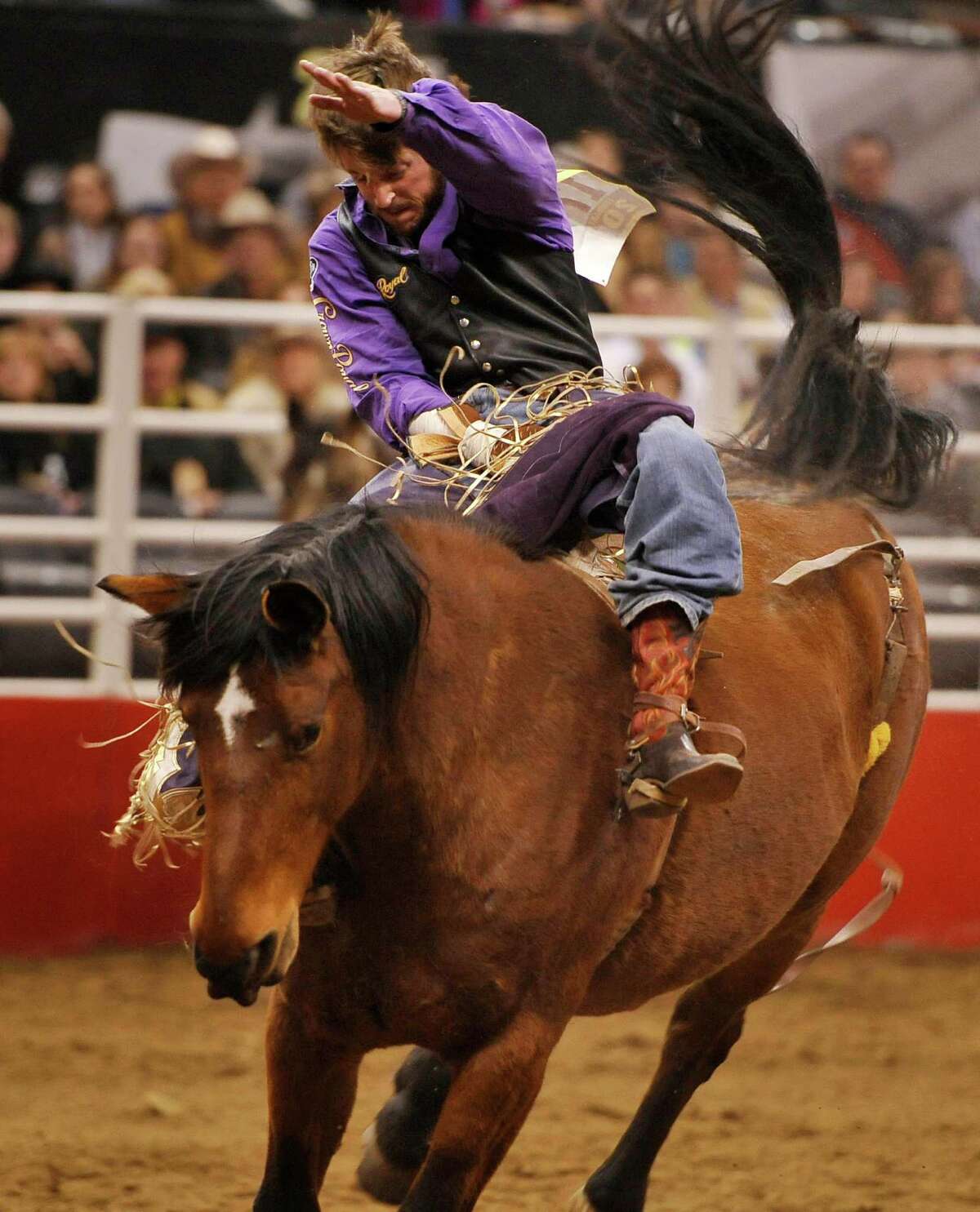 When he's not busting a bronc, he's raising soldiers' morale